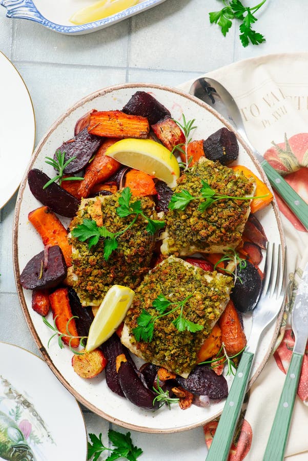 Breadcrumb Crusted Cod Fillet and Baked Root Vegetables Stock Photo ...