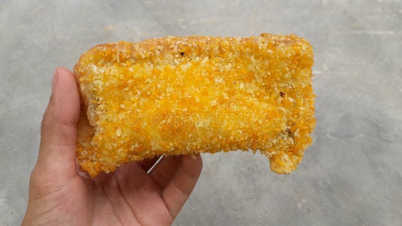 A Breadcrumb Fried Bread in Hand Stock Photo - Image of meal, baking ...