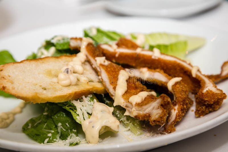 Breaded Chicken on Caesar Salad Stock Photo - Image of fresh, parmesan ...
