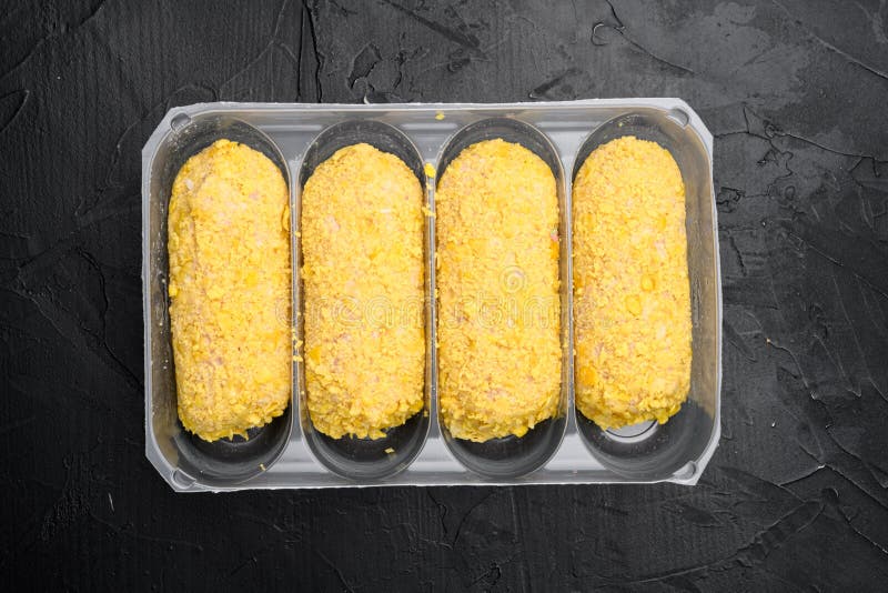 Breaded Chicken Cutlet, in Plastic Market Container, on Black Dark ...