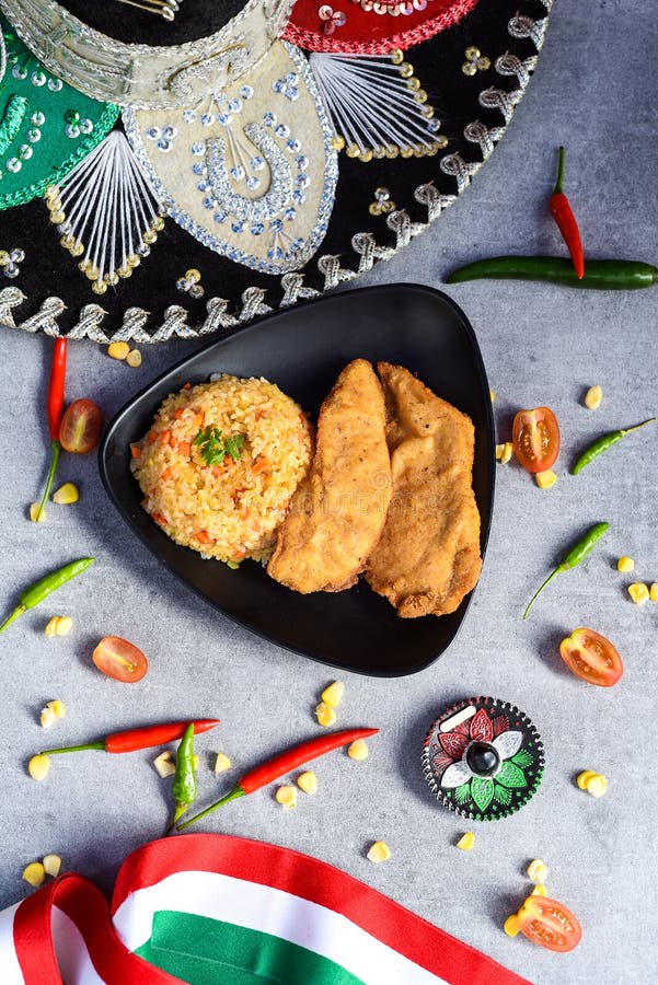 Breaded Chicken Cutlets with Jardinera Mexican Rice Stock Image - Image ...
