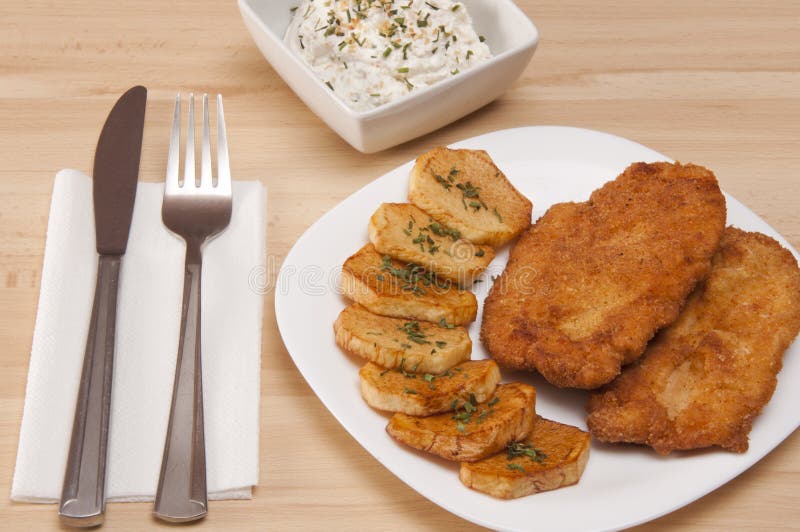 Breaded chicken fillet stock image. Image of silverware - 23912909