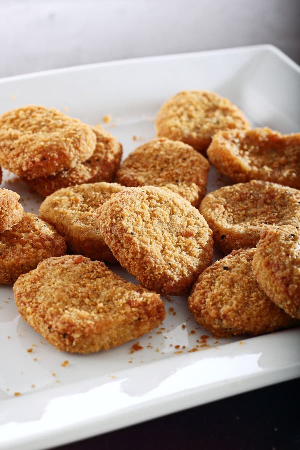 Breaded Chicken Nuggets on a Plate. Stock Image - Image of close ...