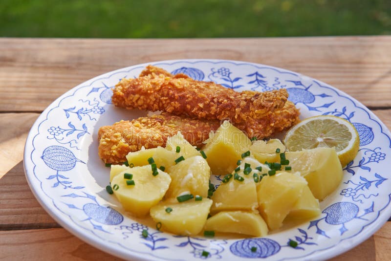 Breaded Cod Fish Fillet from Haddock Served with Potatoes. Stock Photo ...