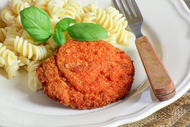 Breaded escalope and pasta stock image. Image of pork - 202694011