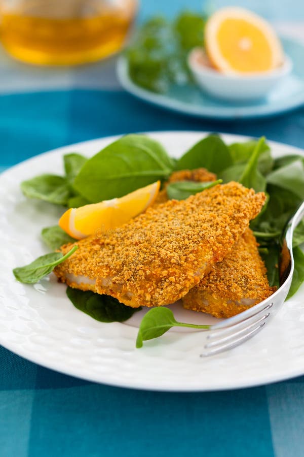 Breaded fish stock photo. Image of herb, bass, fork - 238621534