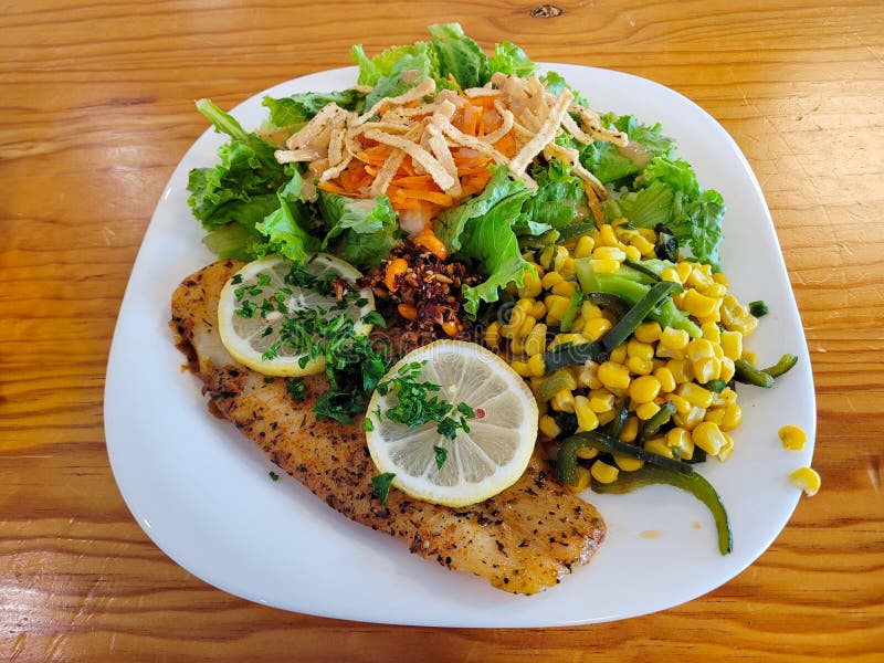 Breaded Fish Fillet with Salad on Wooden Table Stock Image - Image of ...