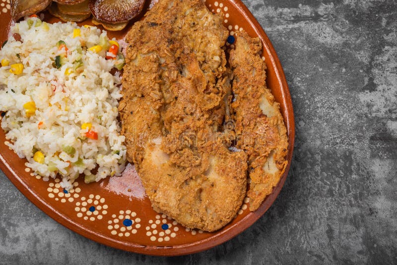 Breaded Fried Fish and Rice in a Clay Dish Stock Image - Image of tasty ...