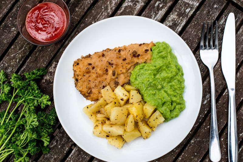 Breaded Haddock Fillet with Parmentier Potatoes and Pea Puree Stock ...