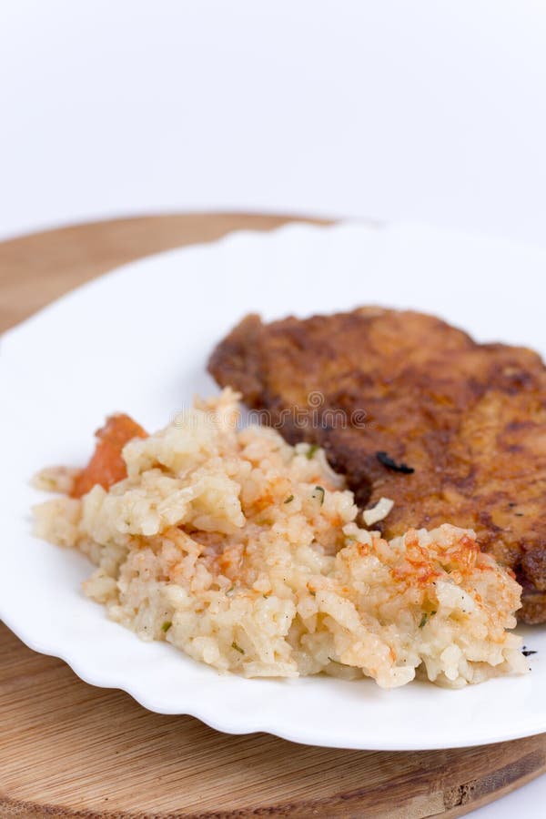 Breaded Meat with Cooked Rice with Vegetables Stock Photo - Image of ...