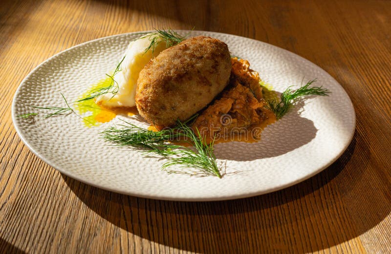 Breaded Meat Cutlets with Mashed Potatoes and Stewed Cabbage Garnish ...