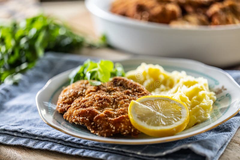 Breaded Meat Served with Potato Mash, Slice of Lemon and Greens Stock ...