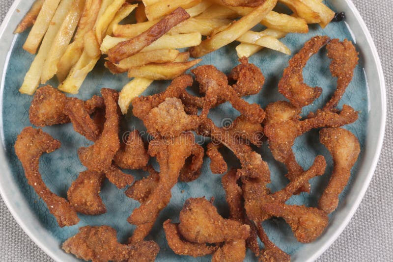 Breaded Rabbit Ribs with Fried Potatoes Stock Photo - Image of potatoes ...