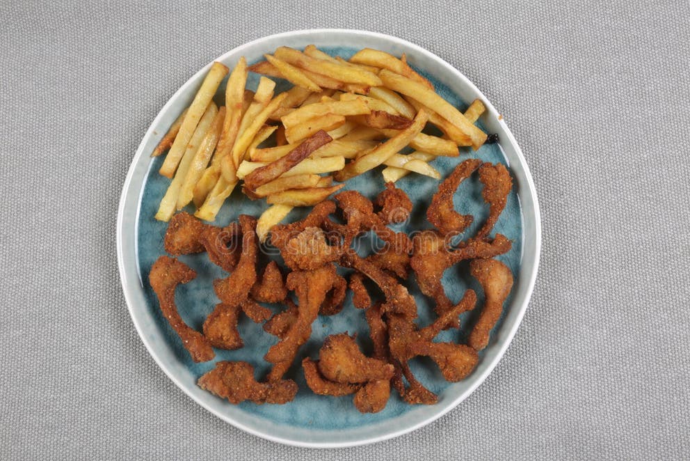 Breaded Rabbit Ribs with Fried Potatoes Stock Photo - Image of meat ...