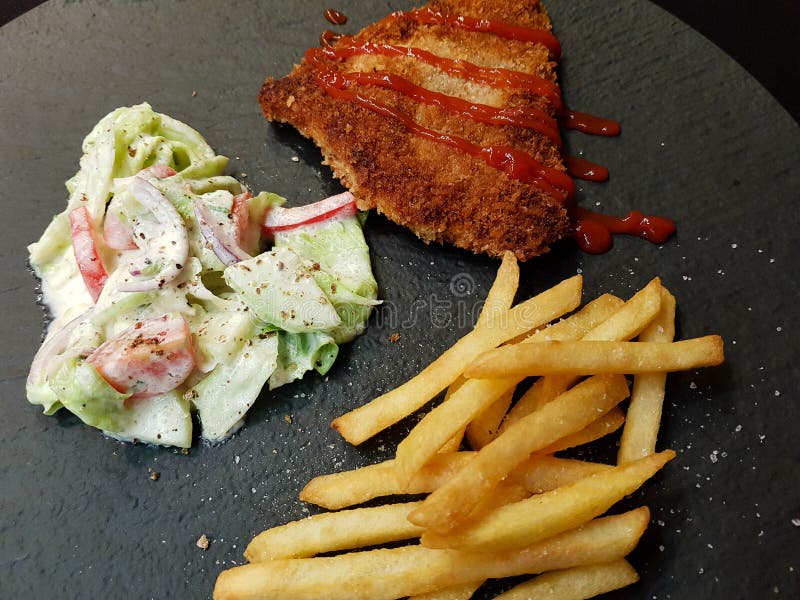 Breaded wiener schnitzel stock image. Image of meal - 278175301