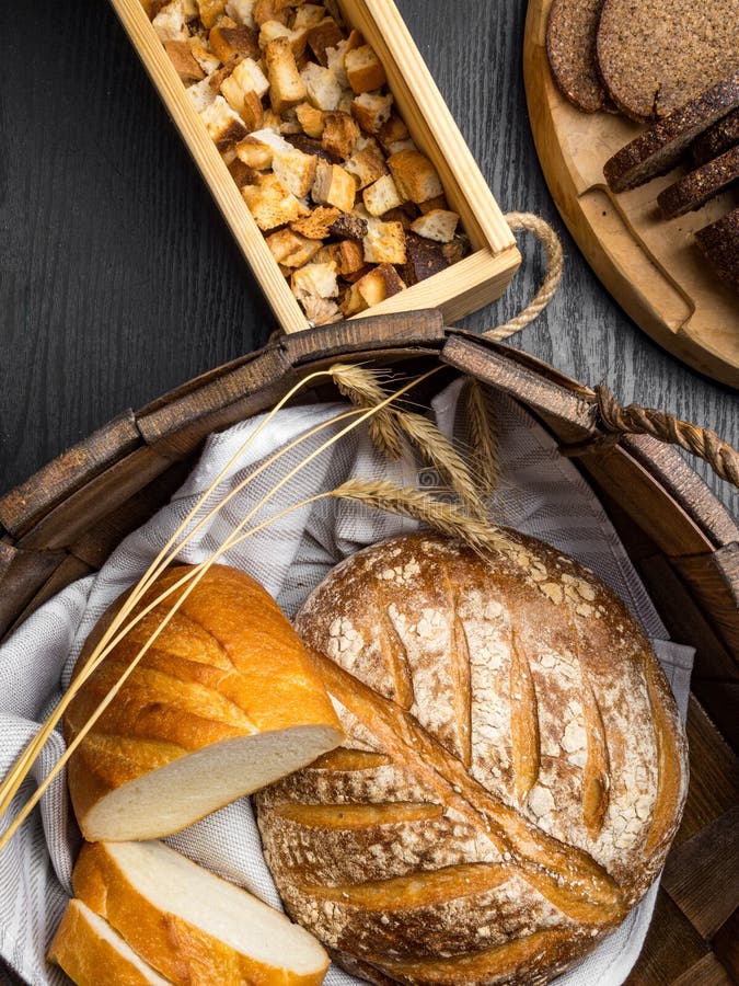 Breads in Baskets, Variety Baking Products on Wooden Surface Stock ...