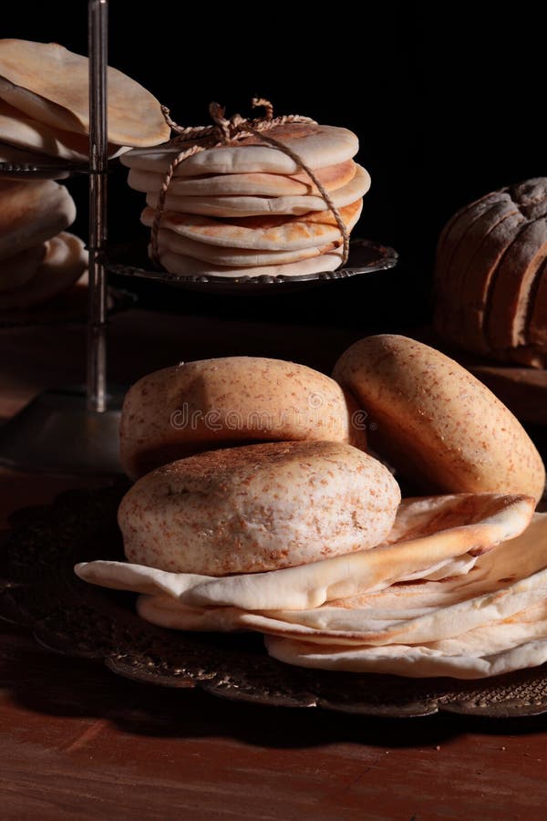Breads on a table stock photo. Image of light, setting - 11861128