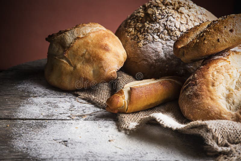 Breads on wooden table stock photo. Image of diet, bread - 108028800