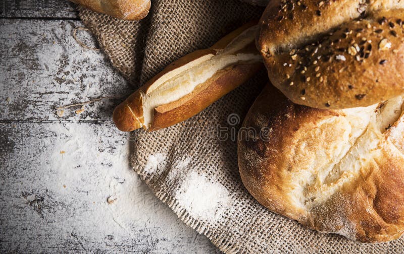 Breads on wooden table stock image. Image of homemade - 108049075