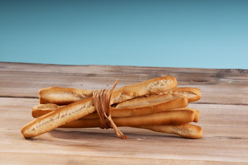 Breadsticks on a Blue Background Stock Photo - Image of bakery ...