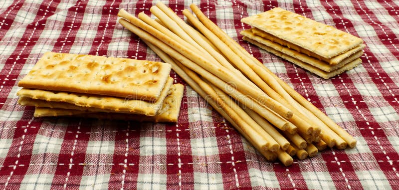 Breadsticks and Crackers on a Picnic Table Cloth Stock Image - Image of ...