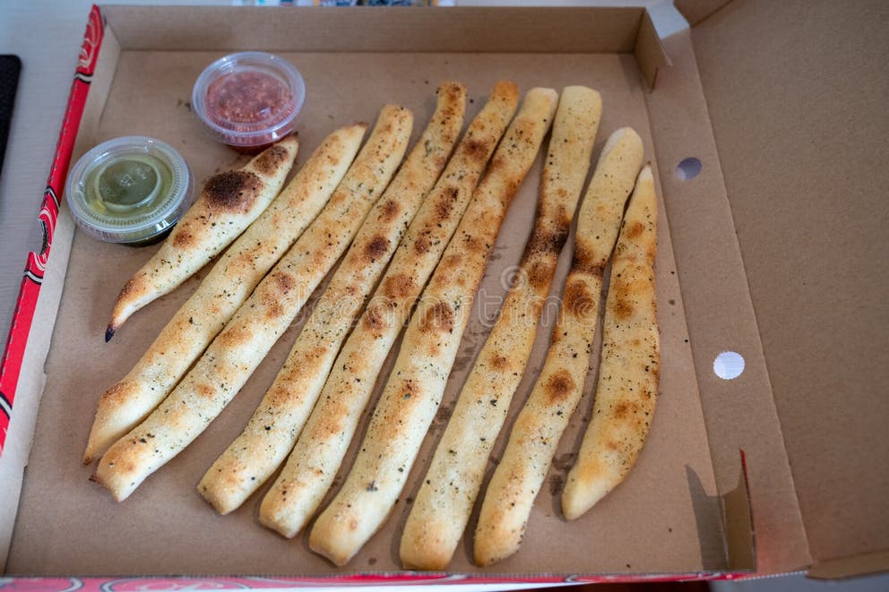 Breadsticks and Dipping Sauce in a Pizza Box Stock Image - Image of ...
