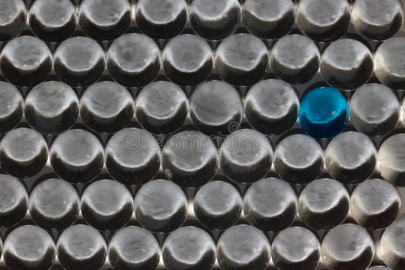 Break the Pattern of Gray Abstract Beads and One Blue that Stands Out ...