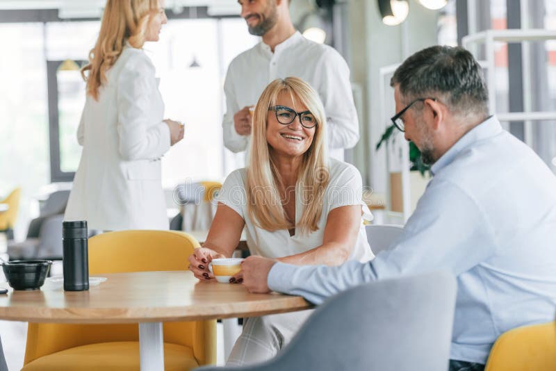 Break Time with Drinks. Group of Professional Business People is in the ...