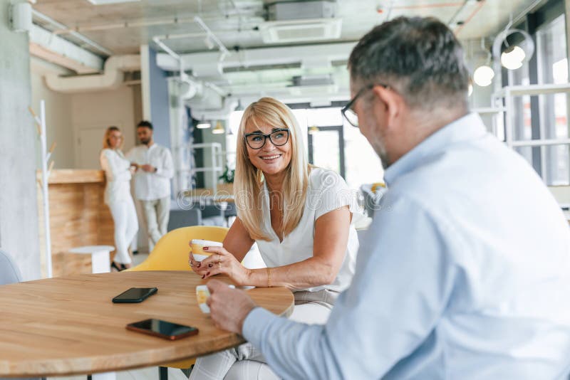 Break Time with Drinks. Group of Professional Business People is in the ...