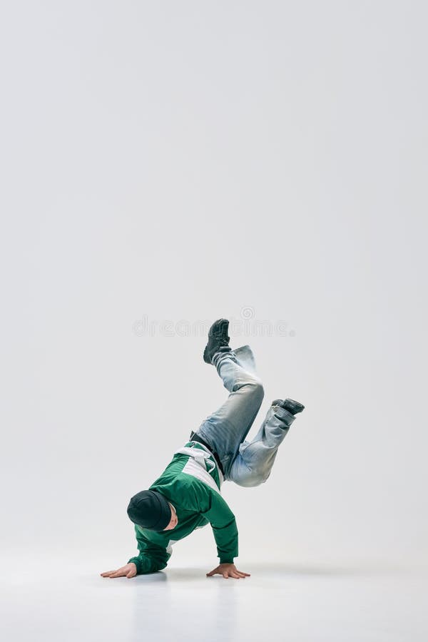 Breakdancer Twisting Mid-air while Balancing on Hands, Showcasing ...