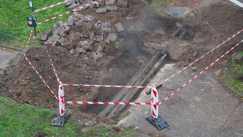 Breakdown of the Heating Main. Problems in Communal Services. Torn Soil ...