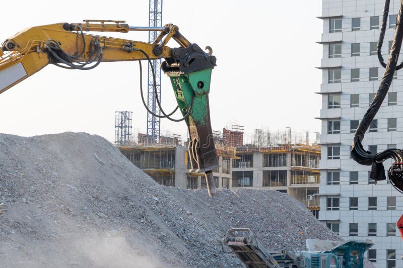 A Breaker on a Construction Site. a Powerful Percussion Hammer Stock ...