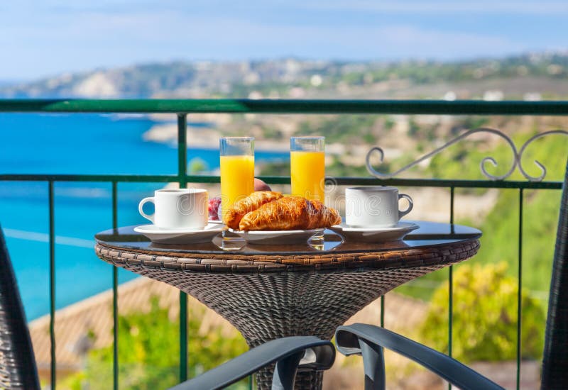 Breakfast on the balcony stock image. Image of nature - 242246811