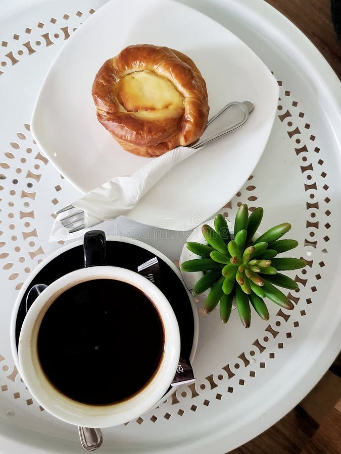 Breakfast with Black Coffee , Cheese Danish and a Green Succulent Stock ...