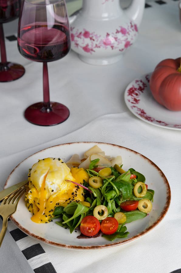 Breakfast Brioche with Poached Egg Benedict and Fresh Salad Stock Photo ...