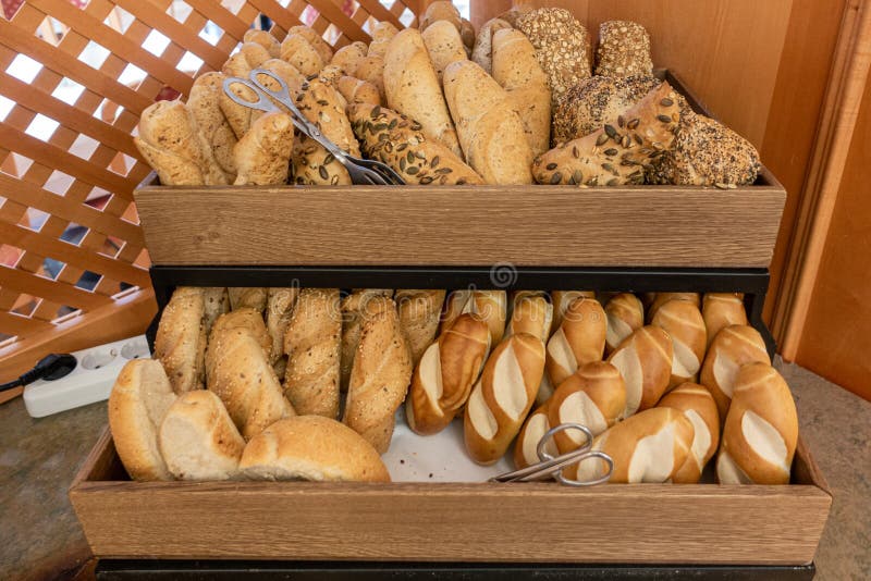 A Breakfast Buffet There are Two Baskets Filled with Different Kinds of ...