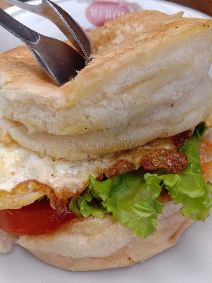 Breakfast Burger Stuffed with Chicken Eggs Stock Photo - Image of ...
