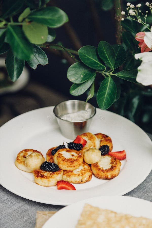 Breakfast with Cheesecakes on a Plate. Cheesecakes with Vegetables, a ...