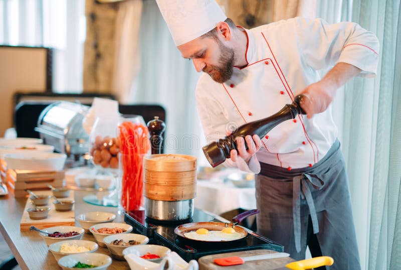 Breakfast. Scrambled Eggs are Cooked on an Induction Cooker in the ...