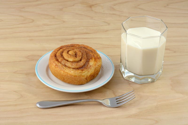 Breakfast of Cinnamon Roll and Glass of Kefir Milk Stock Image - Image ...