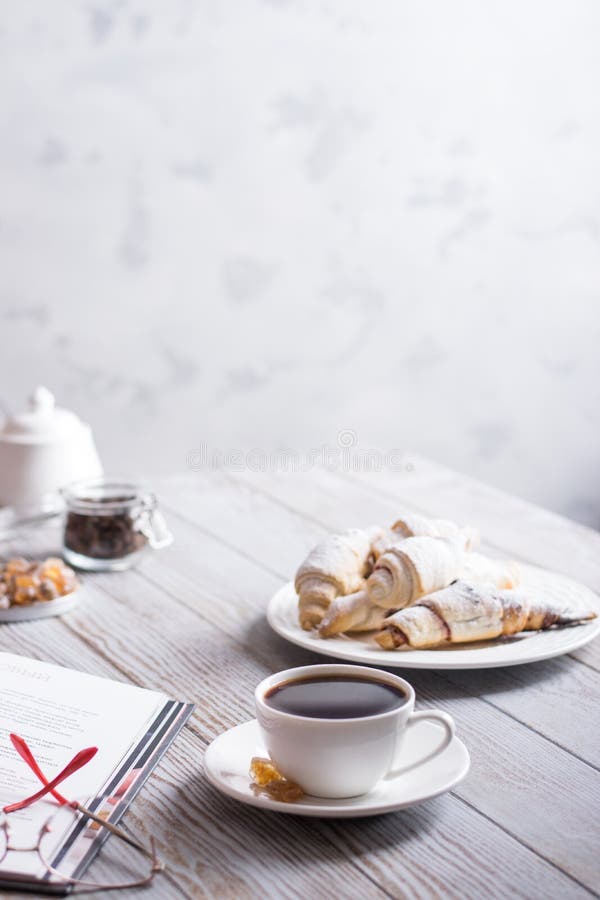 Breakfast with Coffee and Croissants while Reading a Book Stock Image ...