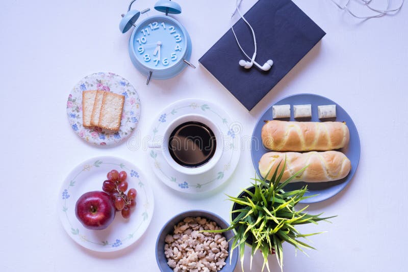 Assorted Food and Coffee with Notebook on the Table. Stock Photo ...