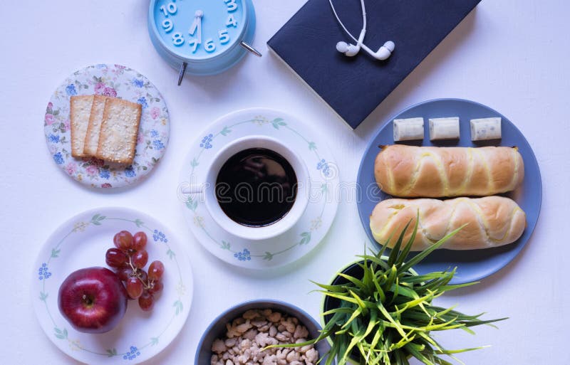Assorted Food and Coffee with Notebook on the Table. Stock Image ...