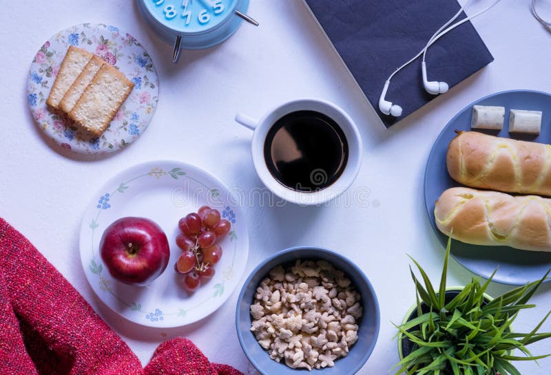 Assorted Food and Coffee with Notebook on the Table. Stock Image ...
