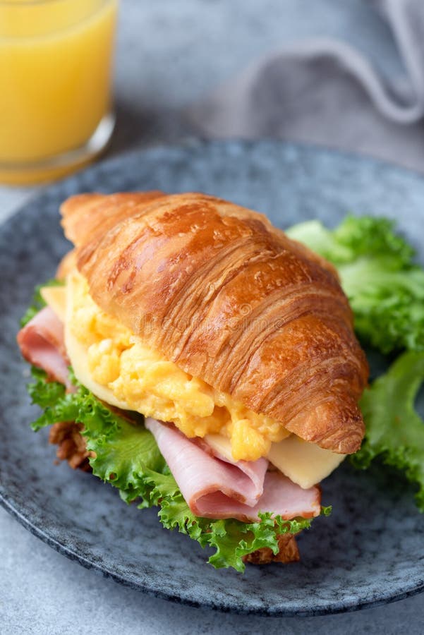 Breakfast Croissant Sandwich with Scrambled Eggs and Ham Stock Photo ...