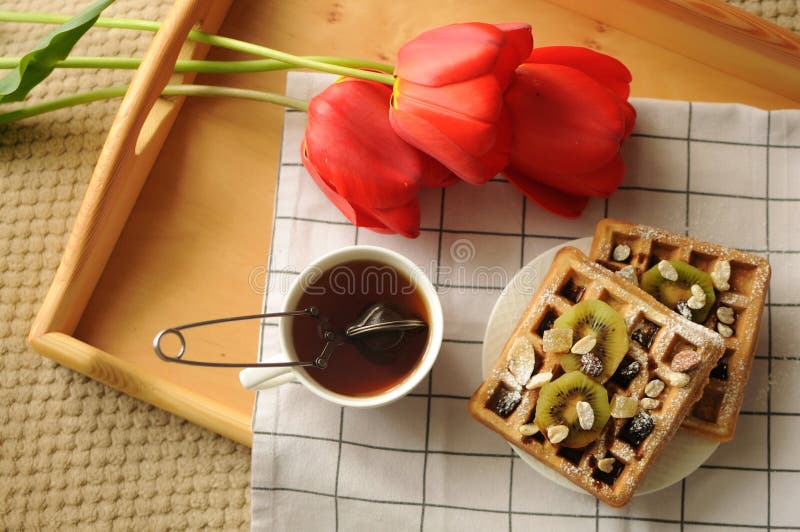Breakfast Flatlay with Homemade Waffles, Black Tea and Red Tulips in ...