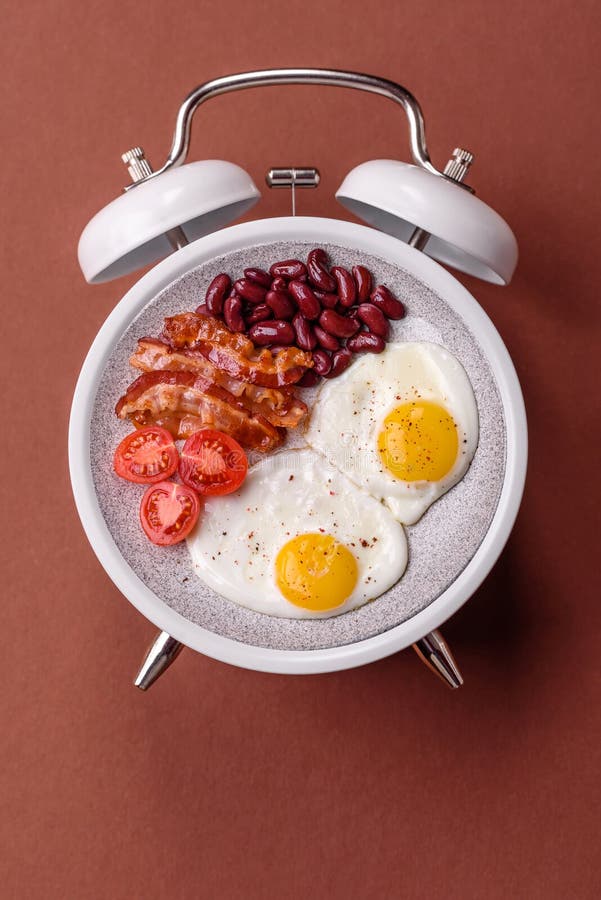 Breakfast of Fried Eggs with Bacon or Sausage and Vegetables. ? Plate ...