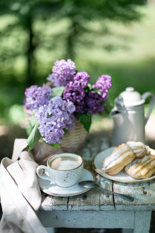 Breakfast in the Garden: Eclairs, Cup of Coffee, Coffee Pot, Lilac ...