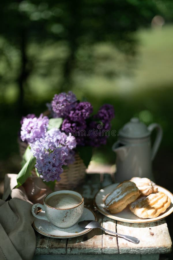 Breakfast in the Garden: Eclairs, Cup of Coffee, Coffee Pot, Lilac ...