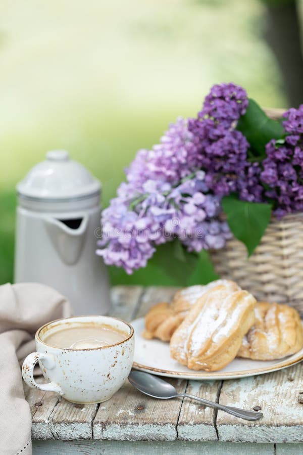Breakfast in the Garden: Eclairs, Cup of Coffee, Coffee Pot, Lilac ...